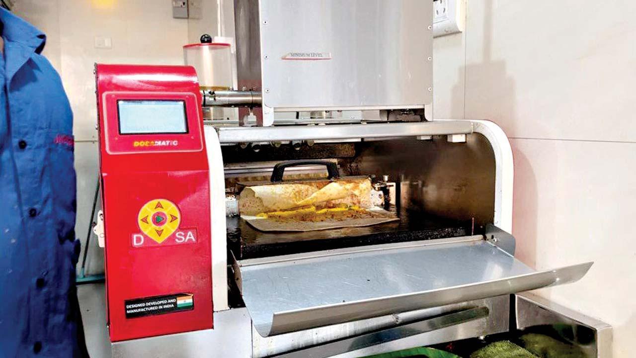An automatic dosa-making machine at Dosaanna food-outlet in Borivali ...